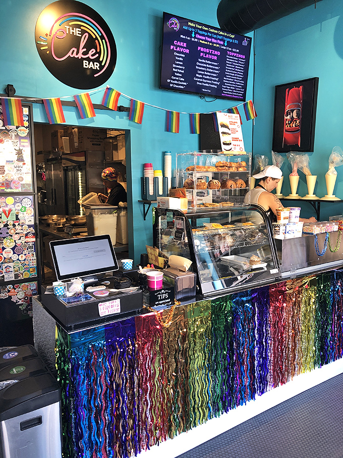 Rainbow tinsel transforms the counter into a glittery wonderland &ndash; Willy Wonka meets Studio 54, but with better dessert options.