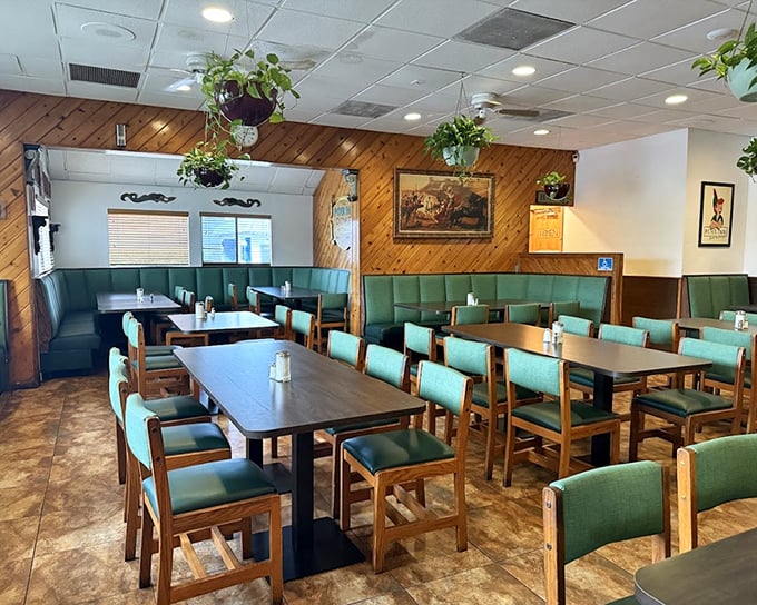 Wood-paneled walls and mint-green booths create the perfect backdrop for morning conversations. Hanging plants add a touch of homey charm.