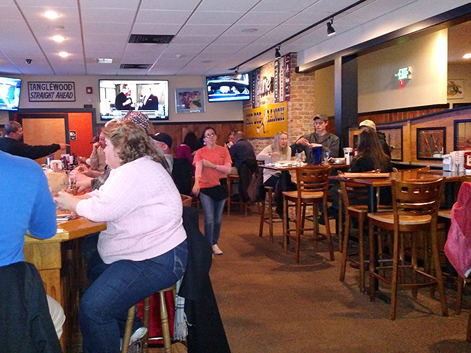 Inside, the warm wood paneling and bustling atmosphere create that perfect neighborhood vibe. Sports on TV, conversations flowing&mdash;this is Massachusetts comfort in its natural habitat. 