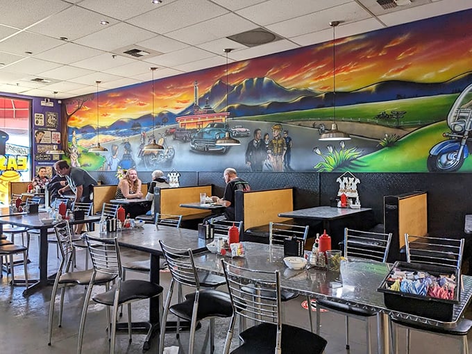The showstopping mural transforms an ordinary meal into a roadside adventure. Comfort food tastes better against a backdrop of vintage cars and dreamy landscapes.