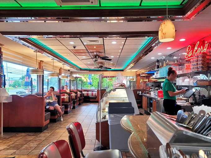 Classic red booths and neon trim create that perfect diner ambiance&mdash;where conversations flow as freely as the coffee refills.
