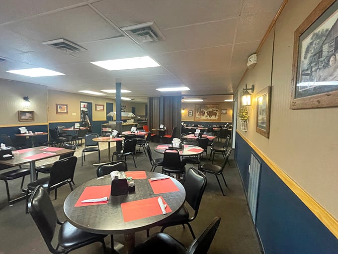 
Classic diner simplicity at its finest &ndash; metal tables, practical chairs, and western-themed artwork create the perfect backdrop for breakfast conversations that matter. 