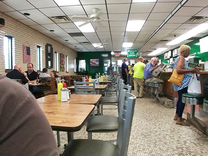 The classic diner interior feels like a time capsule where calories don't count and conversations flow as freely as the coffee.