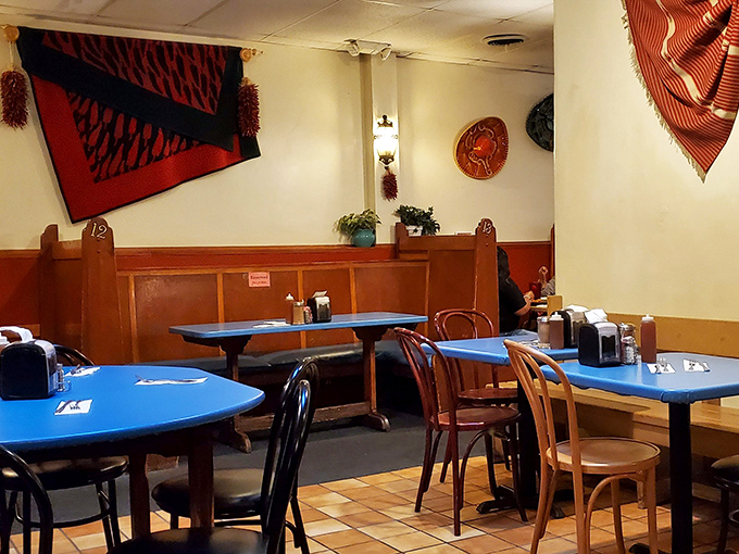 Simple wooden booths and traditional textiles create the perfect backdrop for culinary magic. No pretension here&mdash;just the promise of authentic flavors. 