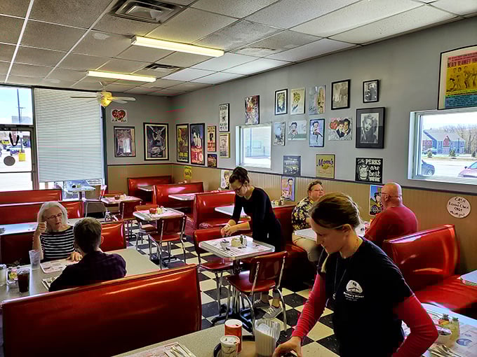Classic red vinyl booths and vintage wall art&mdash;not because it's trendy, but because some things are too perfect to change.