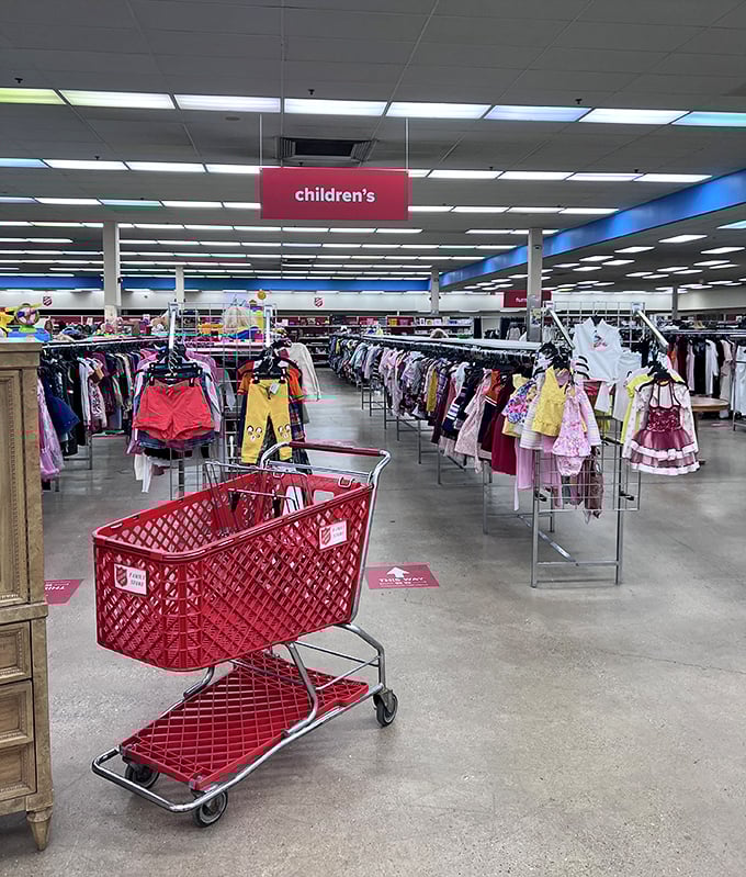 A sea of children's clothing awaits new adventures. Those red carts will be overflowing before you know what hit you.