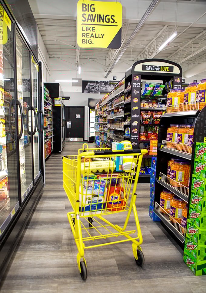 The yellow cart stands ready for adventure, like a bargain-hunting chariot waiting to be filled with treasures that won't break the bank.