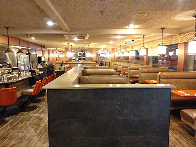 Classic diner comfort meets modern touches in this warm, inviting space where conversations flow as freely as the coffee refills.