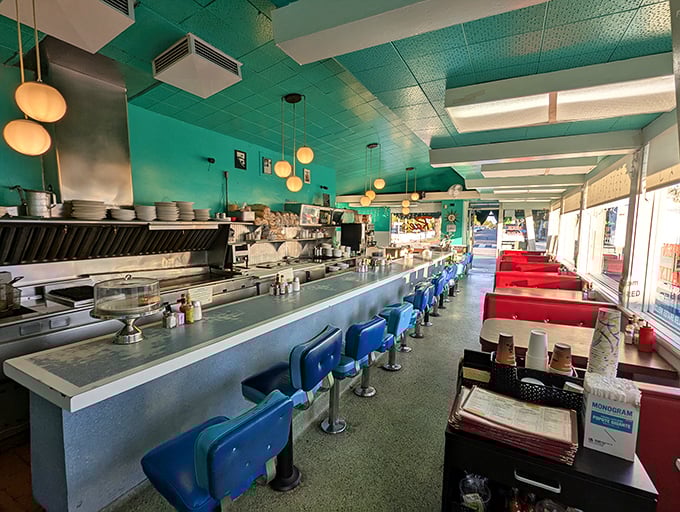 Those blue counter stools and red booths create the kind of authentic diner atmosphere that can't be faked or manufactured.