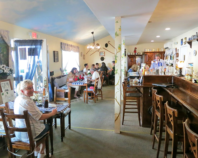 The cozy dining room feels like you've been invited into someone's welcoming home, complete with wooden furniture and Old World charm.