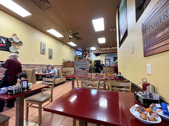 Yellow walls and wooden chairs create that classic diner atmosphere where calories don't count and coffee refills are practically mandatory.
