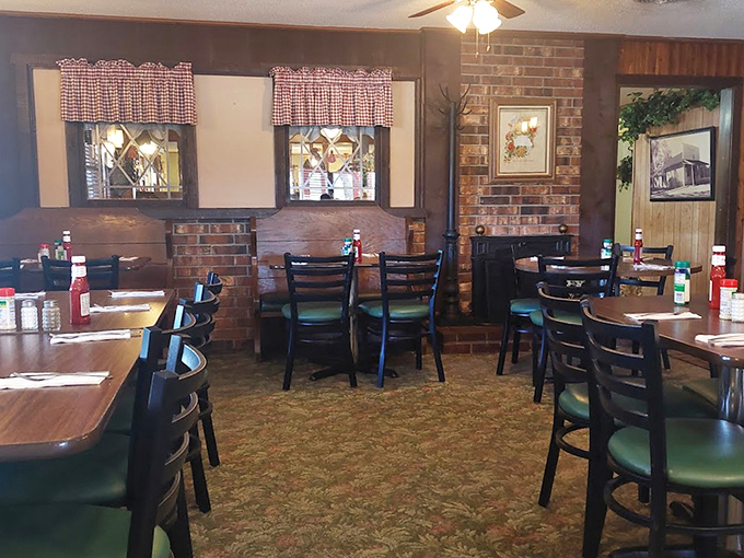 Step inside and you're transported to a simpler time – checkered curtains, wood paneling, and the promise of comfort food done right.