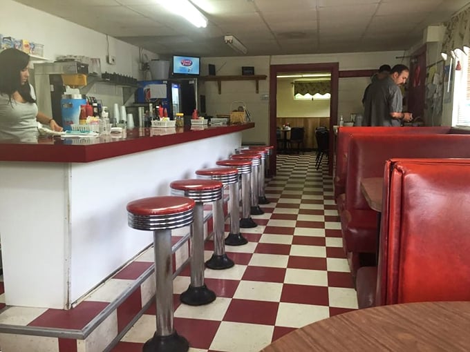 Classic red and white checkered floors lead you past shiny counter stools to culinary paradise. This isn't retro by design&mdash;it's authentic by survival.