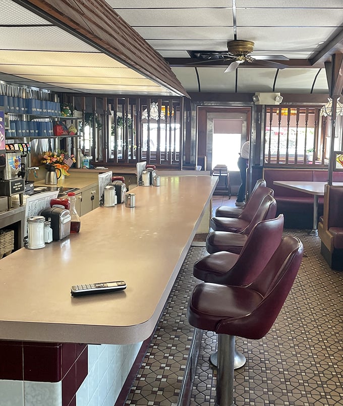 Counter culture at its finest! These burgundy swivel stools have witnessed countless coffee refills and life stories exchanged over home-cooked meals.