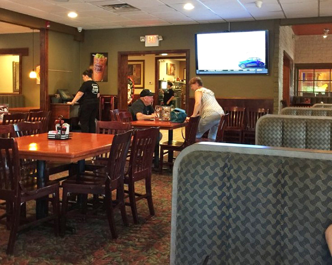Inside, wooden chairs and cozy booths create that perfect diner atmosphere where conversations flow as freely as the coffee. The kind of place where regulars have favorite tables.