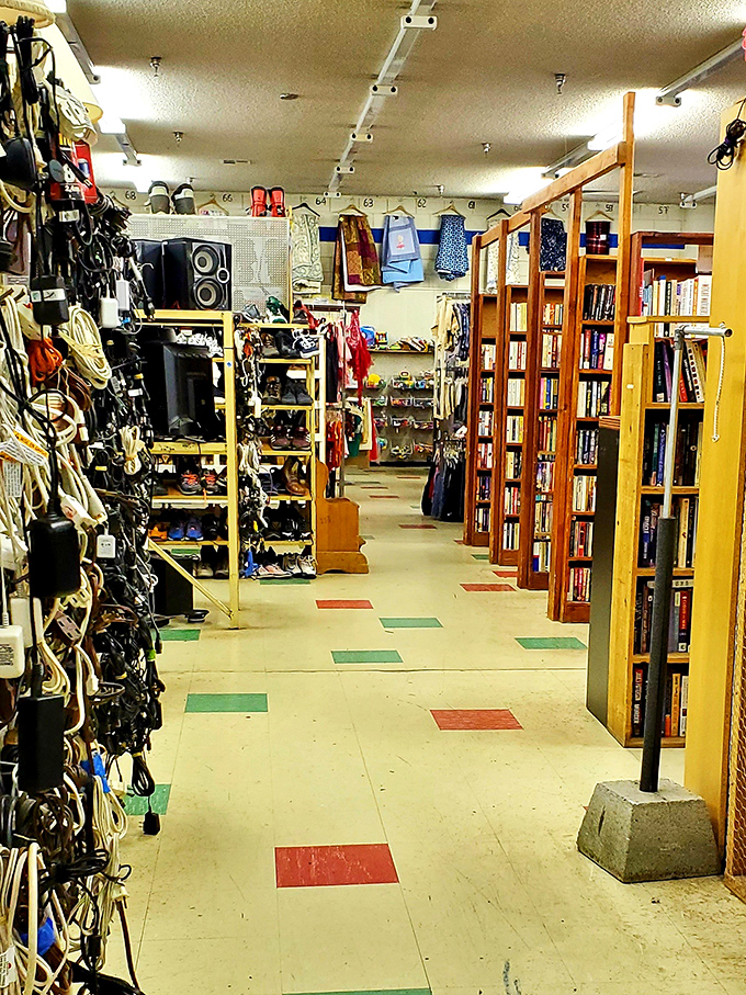 Wooden bookshelves create a mini-library alongside electronics and accessories&mdash;a carefully organized chaos where discoveries await around every corner.