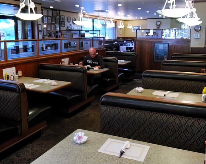 Classic diner booths invite you to settle in and savor the simple pleasures that have kept this place thriving while fancier establishments come and go.