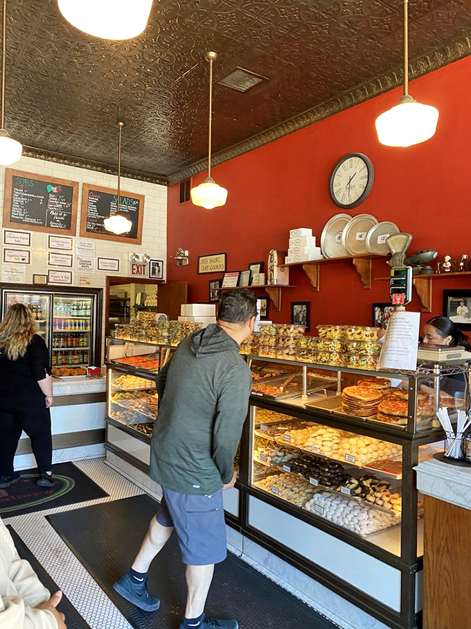 Step inside where display cases overflow with Italian pastries that could make a grown adult weep with anticipation.