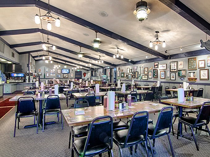 Nautical-themed light fixtures illuminate walls adorned with decades of fishing memorabilia, creating the perfect backdrop for the serious business of all-you-can-eat indulgence.