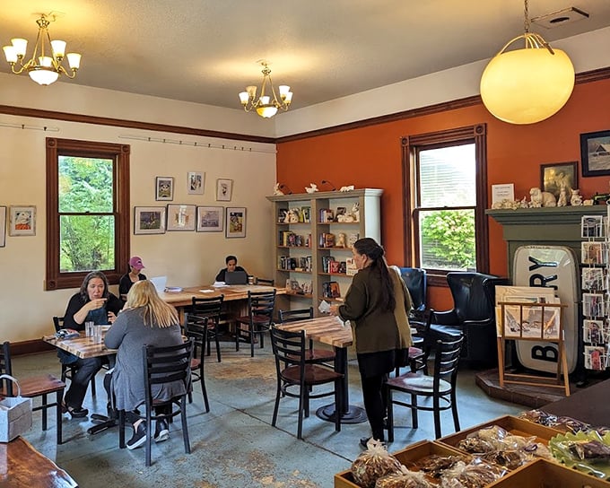 Cozy doesn't begin to describe this living-room-turned-bakery space. Orange walls, wooden accents, and those chandeliers create the perfect setting for carb-laden contemplation.