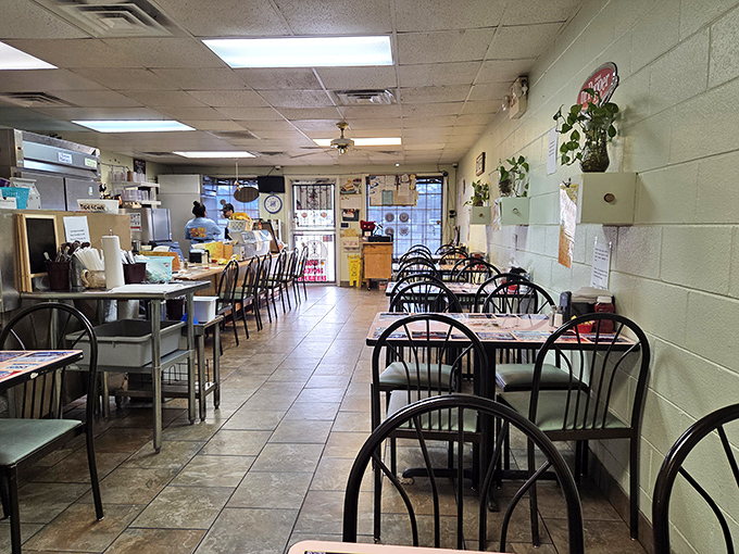 Simple metal chairs, tile floors, and potted plants create the perfect backdrop for food that doesn't need fancy surroundings to shine brilliantly.