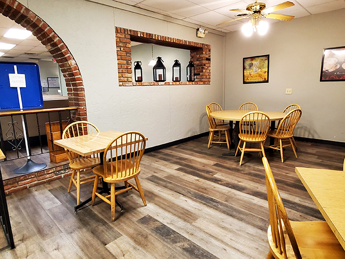 Warm brick archways frame cozy dining spaces where wooden Windsor chairs invite you to settle in for something delicious.