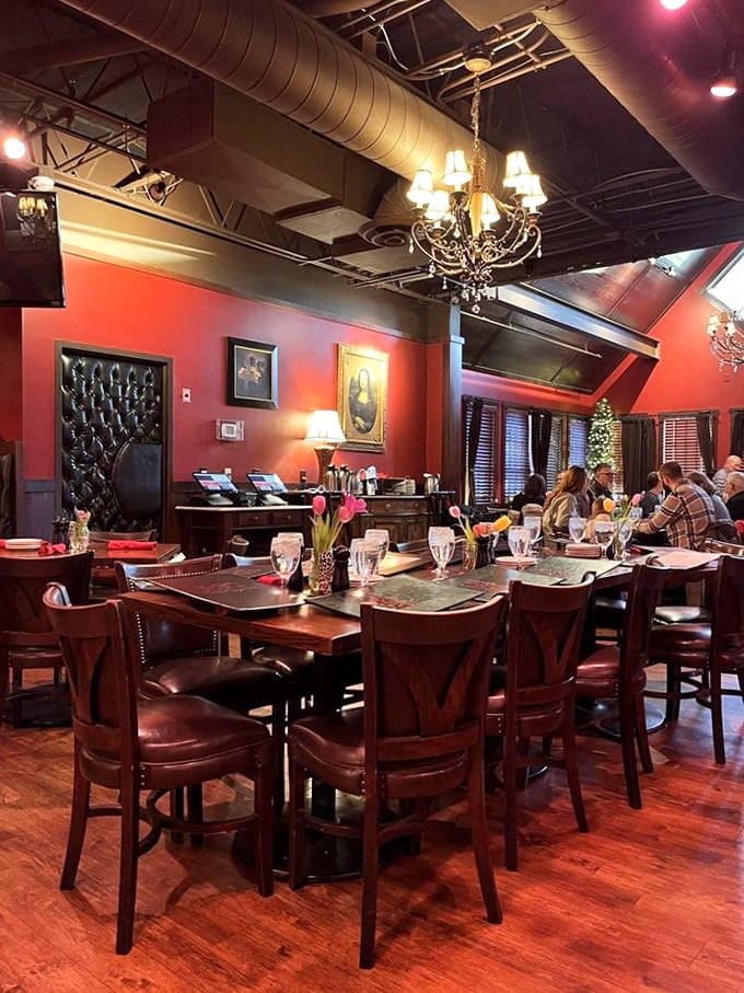 Rich red walls, elegant chandeliers, and leather seating create an atmosphere that says "special occasion" while still letting you know it's okay to laugh loudly.
