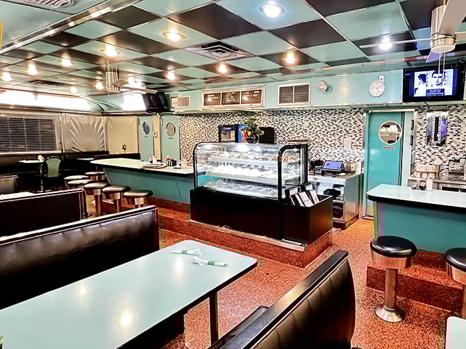 Step back in time with the turquoise and black checkered ceiling, cozy booths, and counter seating that whispers, "Stay awhile, the coffee's always hot."