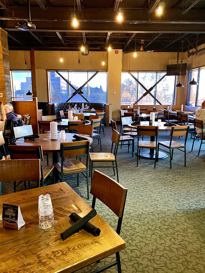 Wooden tables bathed in natural light create the perfect backdrop for both serious conversations and spontaneous laughter.
