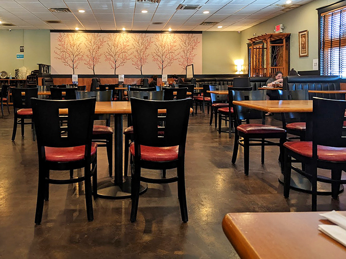 Cherry blossom murals create a serene backdrop for the dining experience. Like Japan's famous sakura season, but without the international flight or crowds.