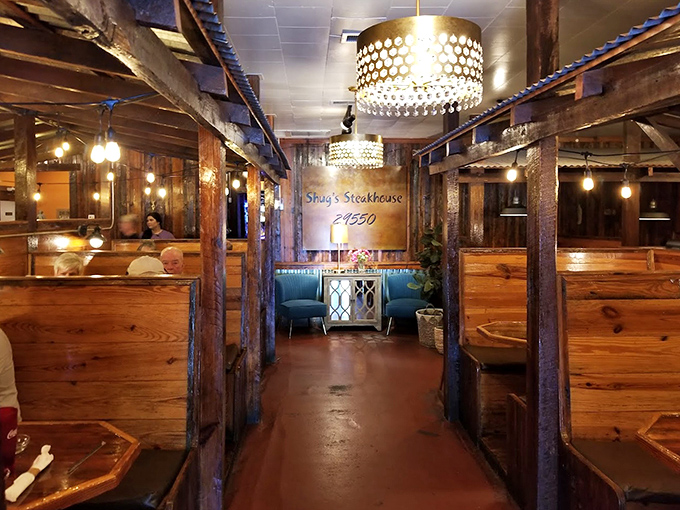 Walking through these wooden booths feels like entering a rustic cathedral where the religion is great food and the hymns are sizzling steaks.