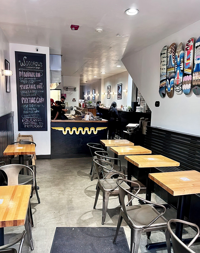 The cozy interior balances modern minimalism with skateboard flair &ndash; proof that serious sandwich artistry doesn't require white tablecloths.