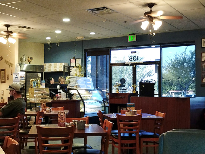 Classic diner ambiance with ceiling fans and wooden tables creates that "everybody knows your name" feeling. Comfort begins before the first bite.