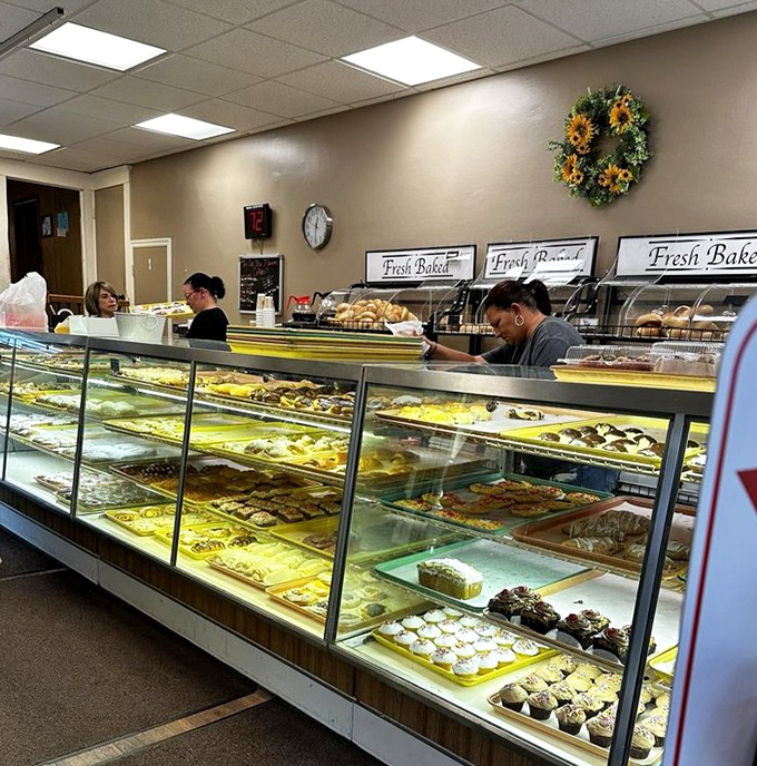Bakery cases that could make a diet plan spontaneously combust. Each tray holds decades of perfected recipes and the collective joy of countless celebrations.