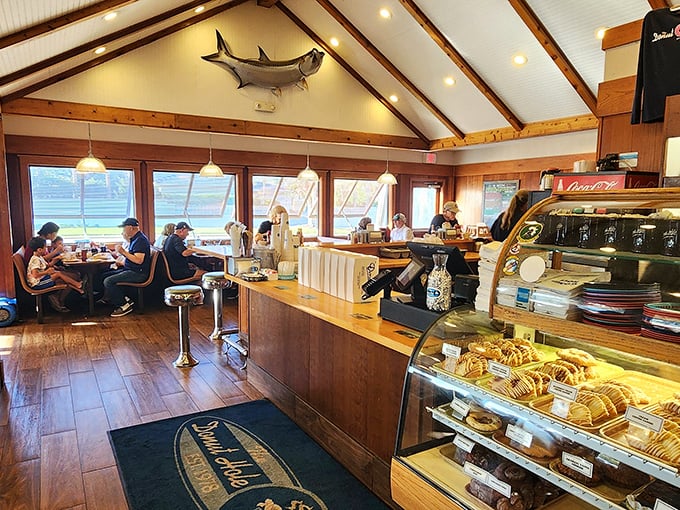 Coastal charm meets breakfast paradise under those wooden beams. That mounted fish has witnessed more delicious meals than most food critics.