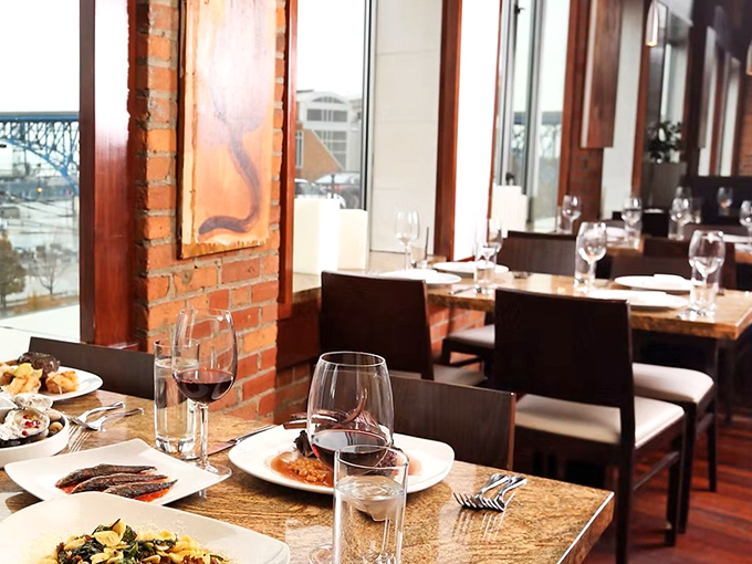 Exposed brick walls and natural light create the perfect backdrop for culinary magic. Like dining in a rustic Italian villa, but with Cleveland's skyline nearby.