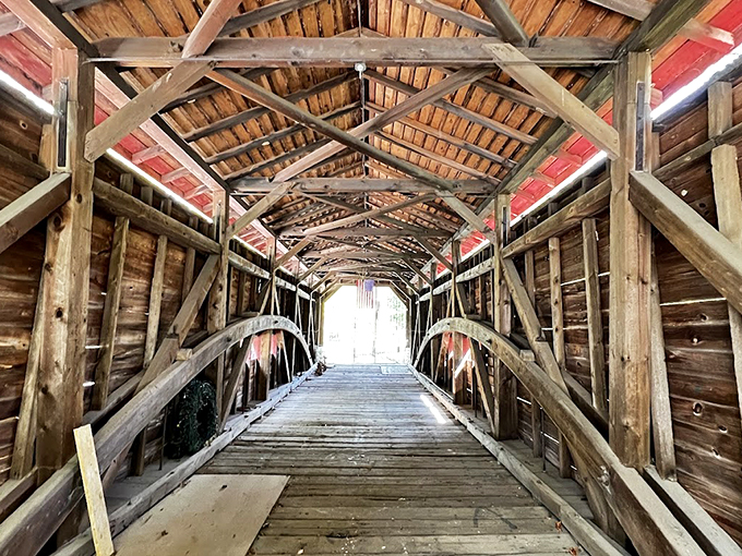 Step inside and you're transported to another century. The wooden lattice truss design creates a cathedral-like atmosphere where sunlight plays between ancient beams.