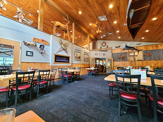 Rustic wooden beams and wildlife mounts create that perfect "fancy cabin" vibe where both flannel shirts and date night outfits feel equally at home.