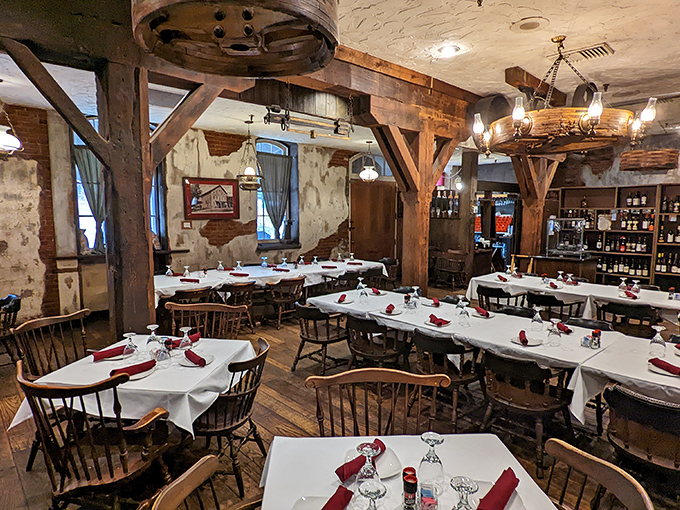 Step inside to discover rustic elegance where history meets hospitality&mdash;exposed beams and white tablecloths creating the perfect backdrop for culinary magic.