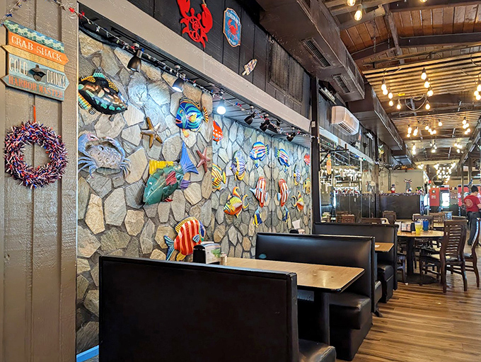 Stone walls adorned with colorful fish create an underwater grotto vibe that's kitschy in all the right ways.