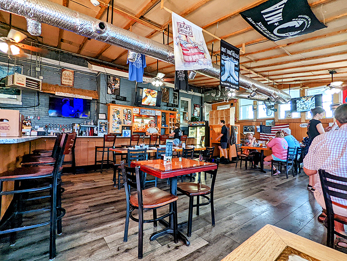 Inside, the wood-paneled walls tell stories of countless seafood feasts, while nautical flags hang like trophies from fishing expeditions past.