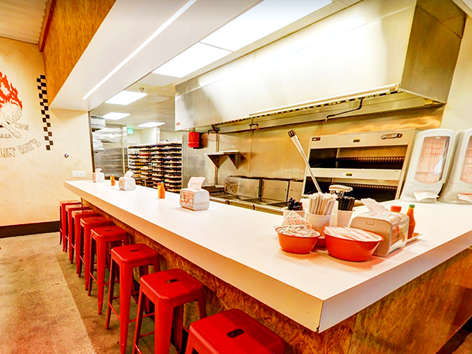 Minimalist design, maximum flavor. The no-frills interior with its signature red stools lets you know they're focused on what matters most&mdash;the chicken.