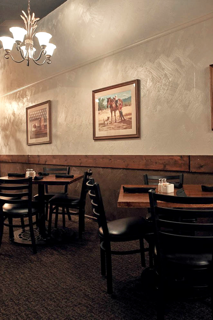 Western artwork and warm wood paneling create that perfect "I've discovered somewhere special" feeling that chain restaurants can't manufacture.