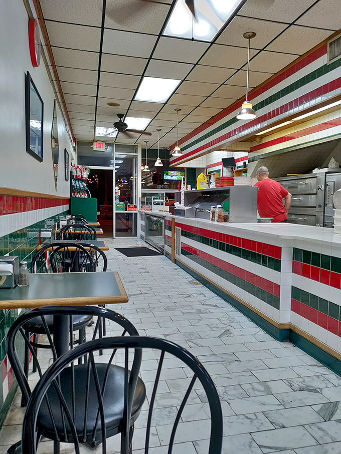 Red, white, and green tiles line the walls like an edible Italian flag. This narrow slice of heaven proves great pizza doesn't need fancy surroundings.