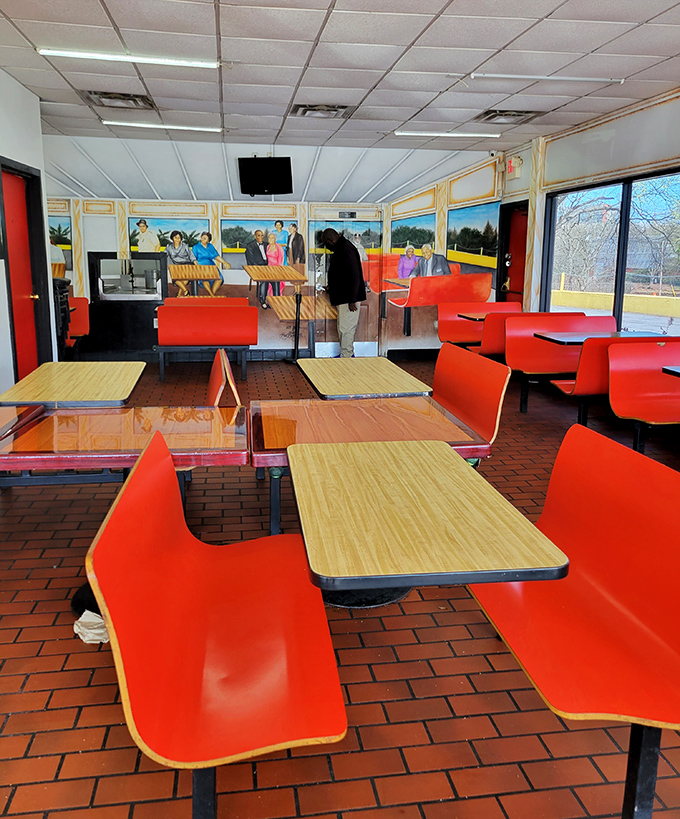 Retro red seats and wood-grain tables create a time capsule of Southern hospitality. This isn't trendy décor—it's authentic Atlanta soul.