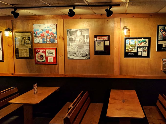 Simple wooden booths and history-lined walls tell stories of satisfied diners past. This isn't Instagram decor&mdash;it's authentic New England character.