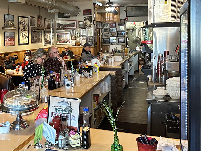 Where conversations flow as freely as the coffee, this narrow slice of diner heaven proves good things come in cozy packages.