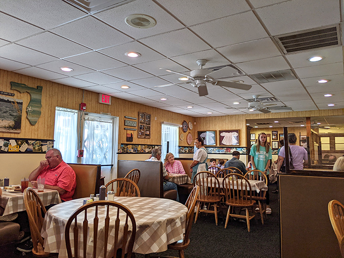 Wood-paneled walls, checkered tablecloths, and Windsor chairs create that perfect "grandma's dining room" atmosphere where comfort food tastes even better.