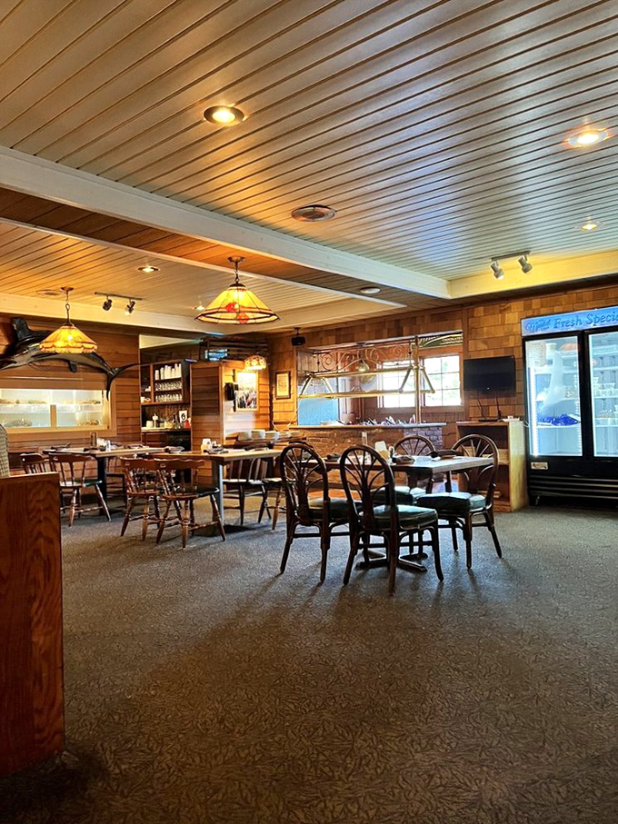 Wooden paneling, nautical touches, and those Tiffany-style lamps create the perfect mood lighting—like a cozy ship's cabin where calories don't count.