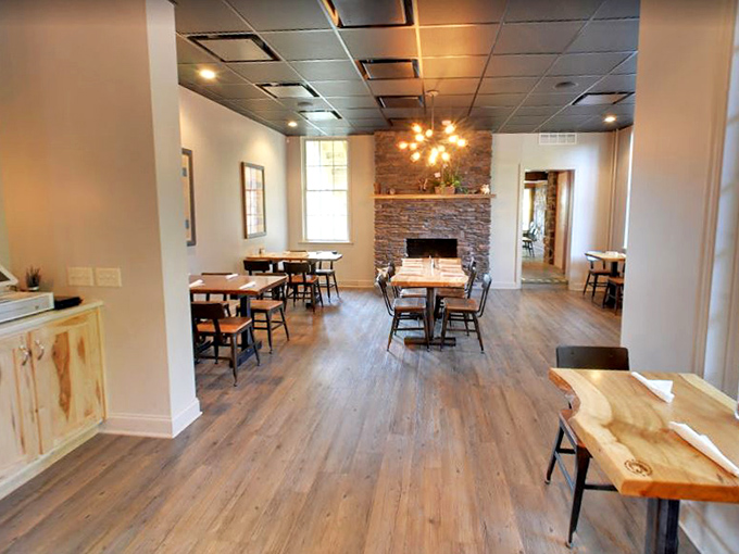 Clean lines, wooden tables, and that gorgeous stone fireplace create a dining room where the food, not the decor, rightfully takes center stage.